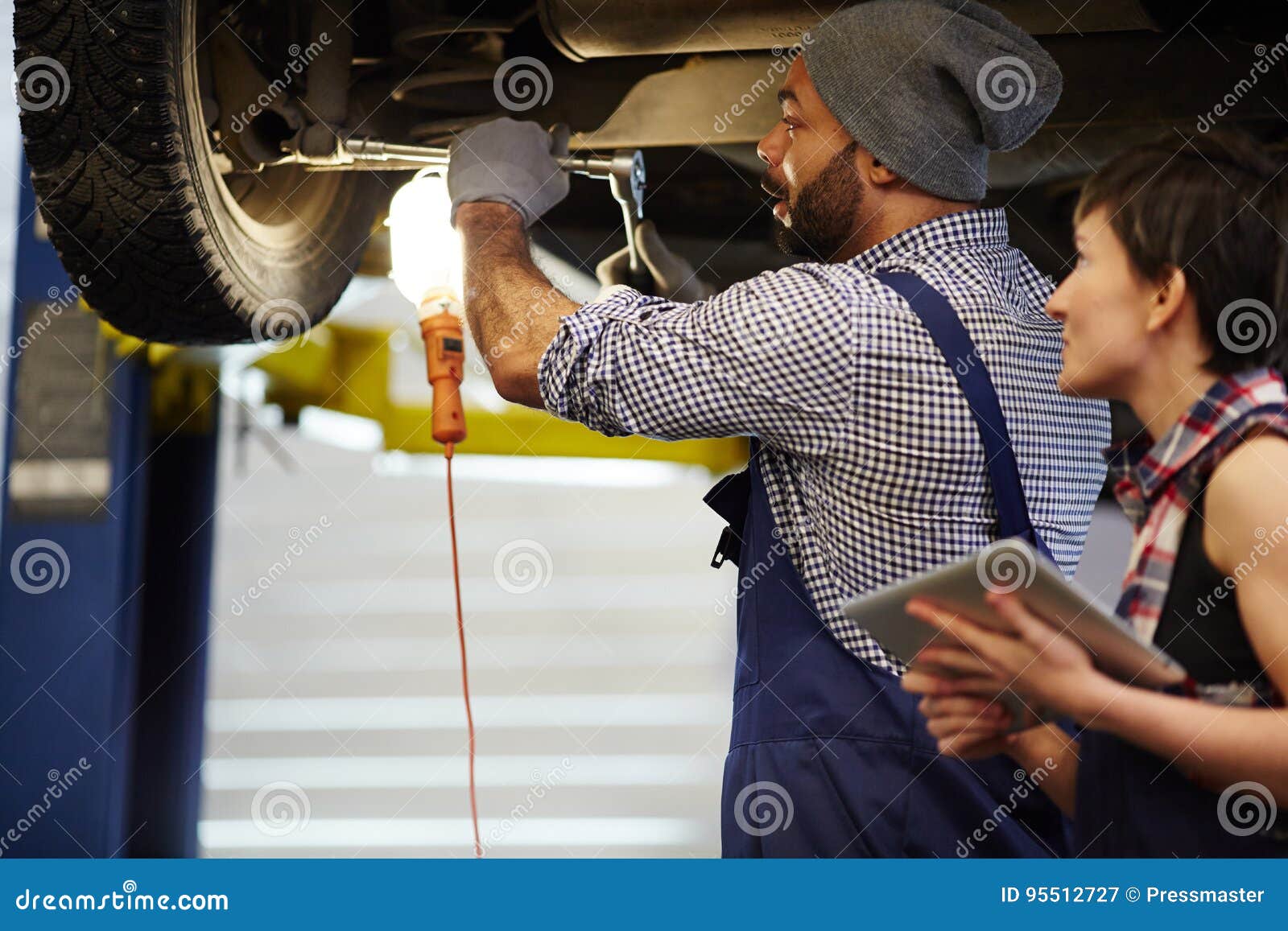 Teamwork of technicians stock image. Image of profession - 95512727