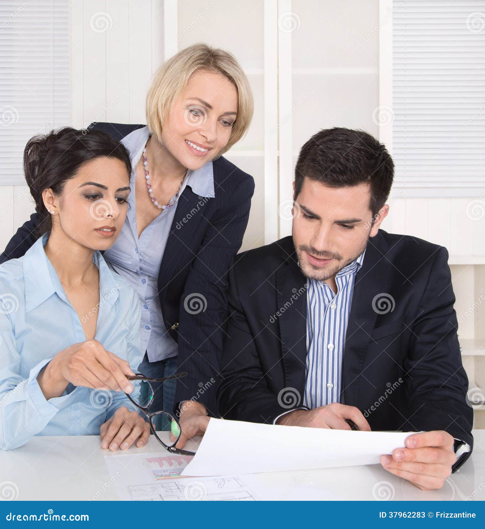 Teamwork between Three Business People at Desk at Office. Stock Image ...