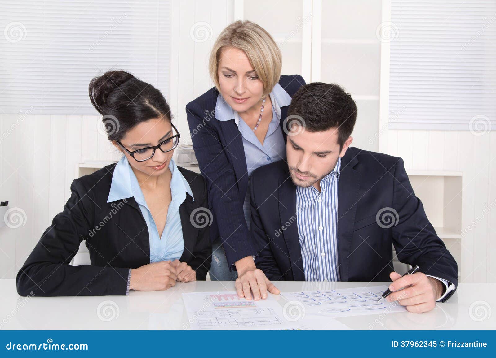 Teamwork between Three Business People at Desk at Office. Stock Image ...