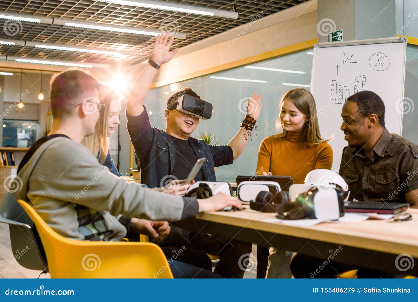 Teamwork Trying Virtual Reality Glasses for Work in Creative Office ...
