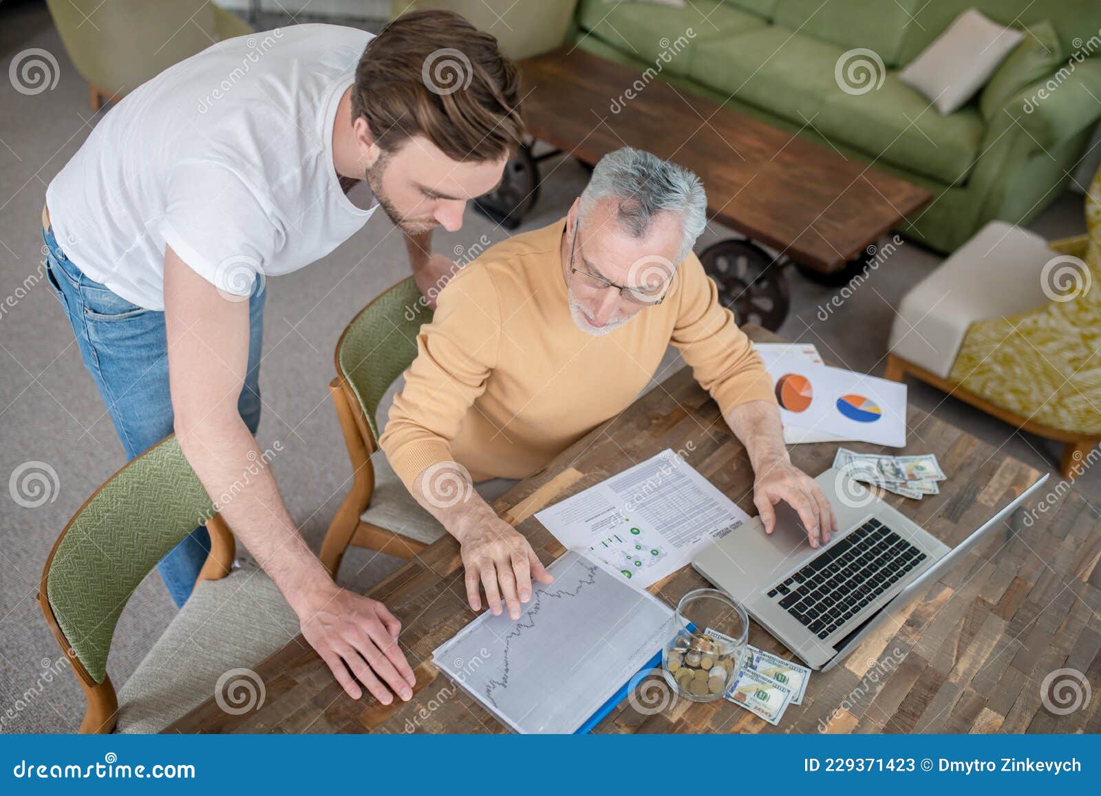 Two Men Working Together on a Project and Looking Involved Stock Image ...