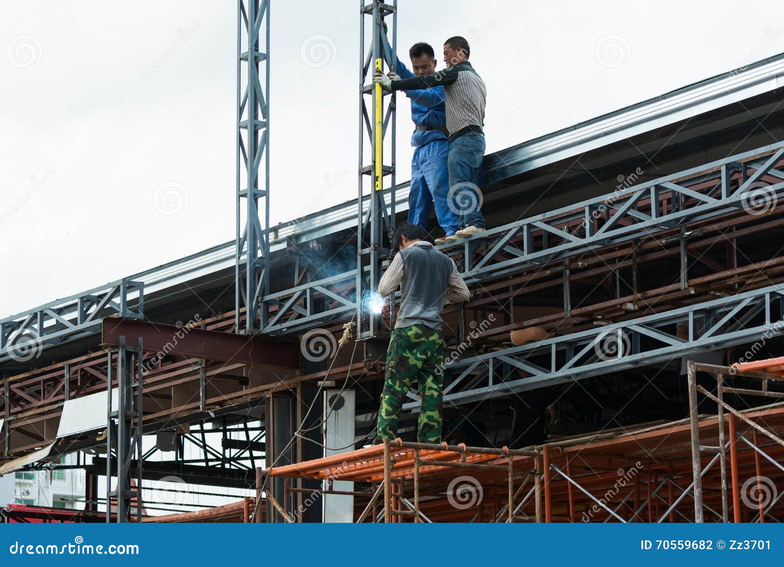 Teamwork of workers editorial photography. Image of iron - 70559682