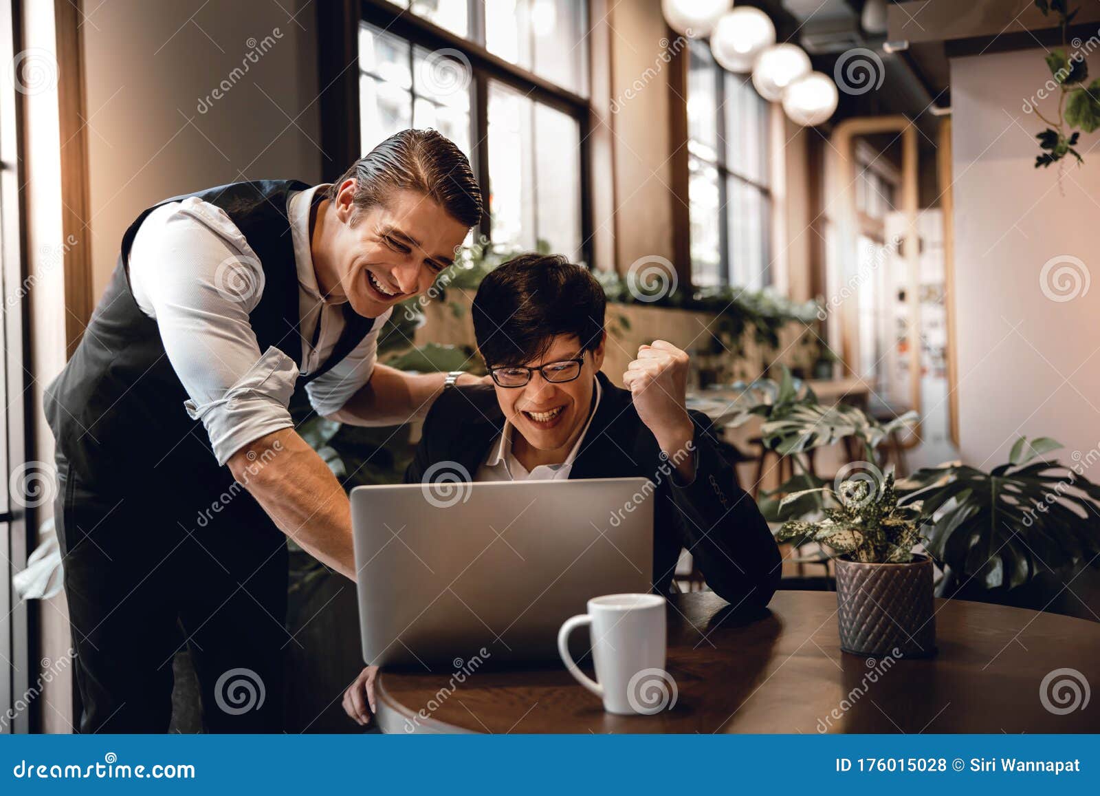 Teamwork or Working Together Concept. Two Businessman Working on Laptop ...