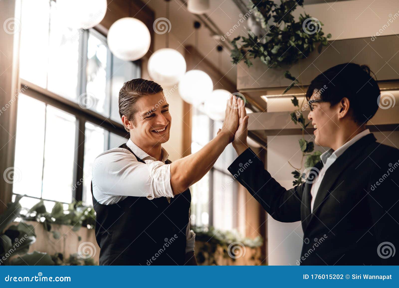 Teamwork or Working Together Concept. Two Businessman Making High Five ...