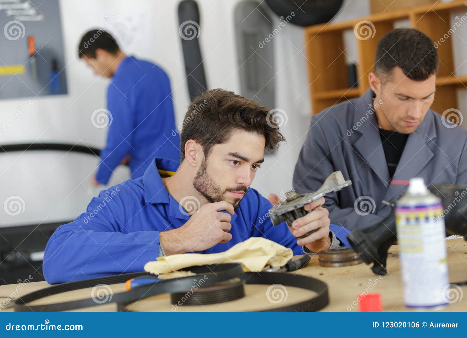 Teamwork in the workshop stock photo. Image of creation - 123020106