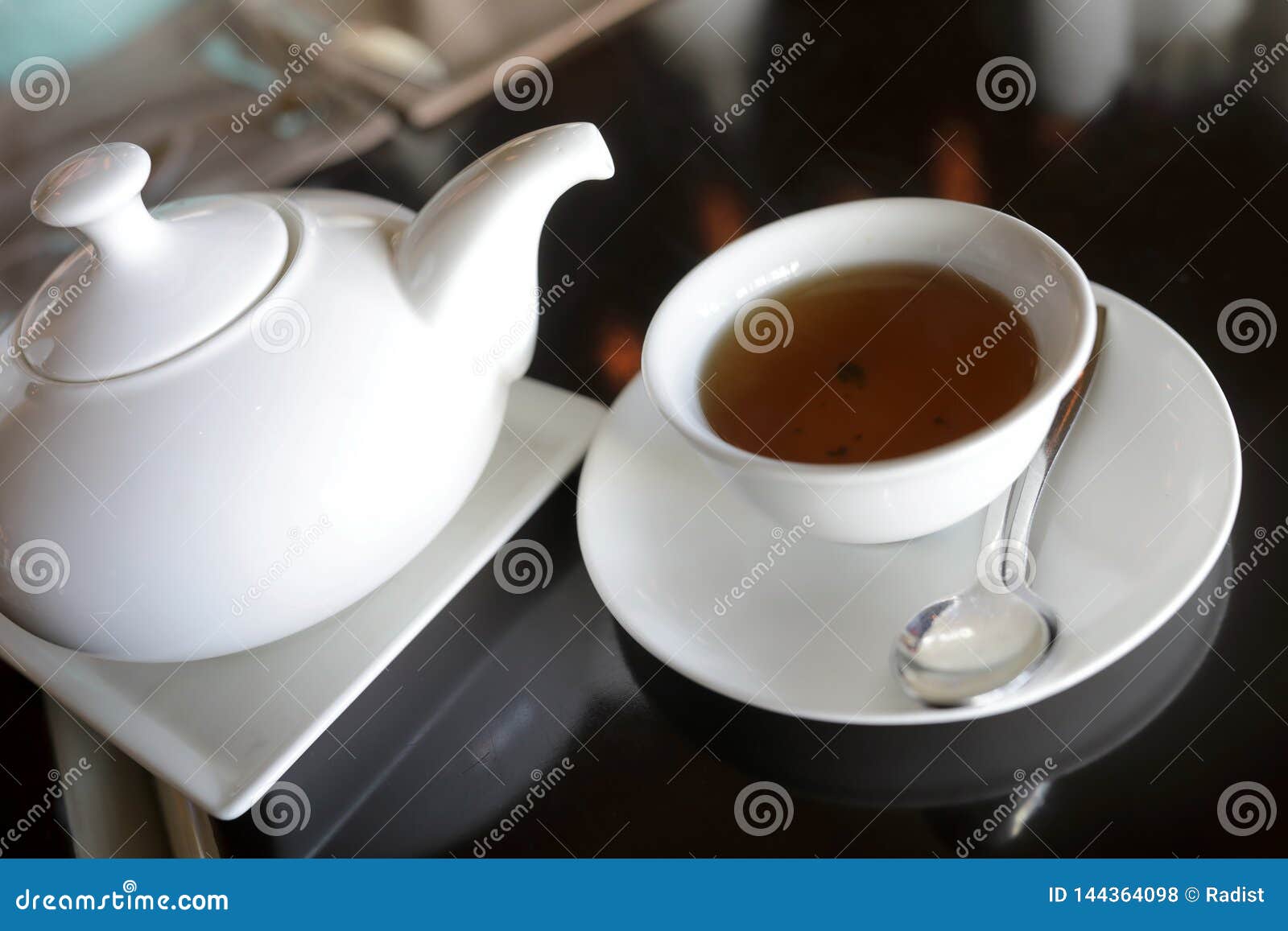 Teapot and teacup with tea stock photo. Image of morning - 144364098