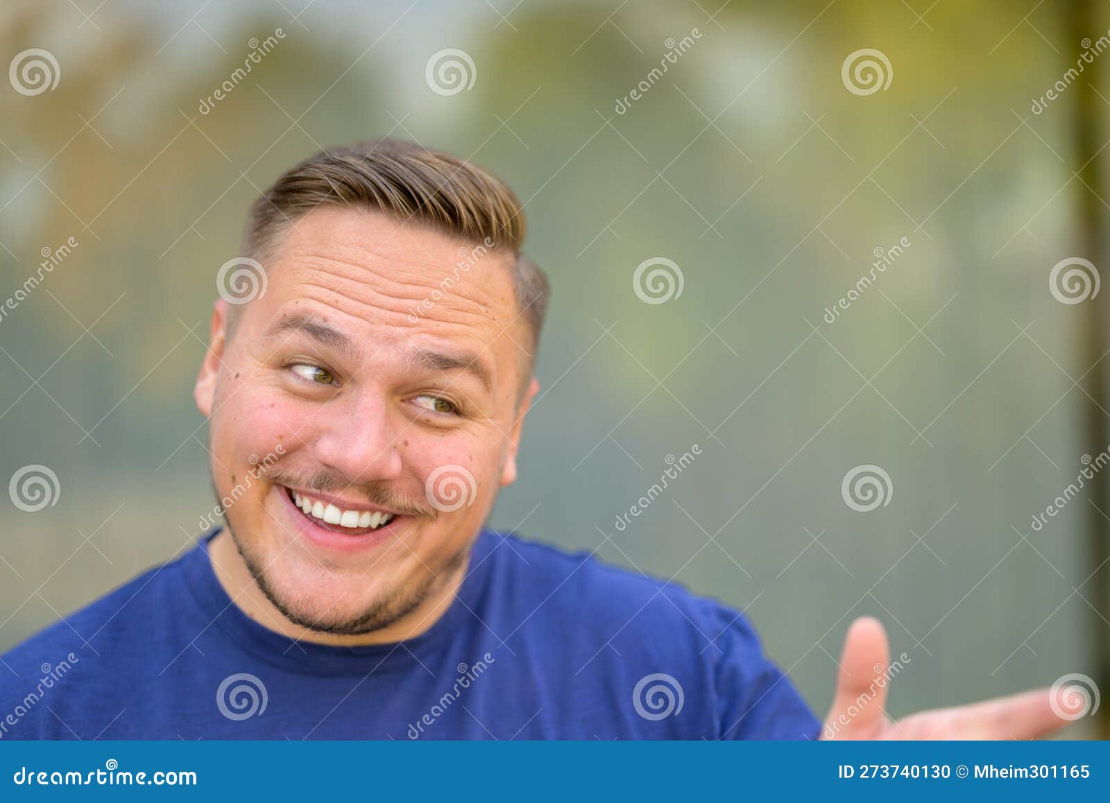 Teasingly Smiling Young Man Pointing at Someone Stock Photo - Image of ...