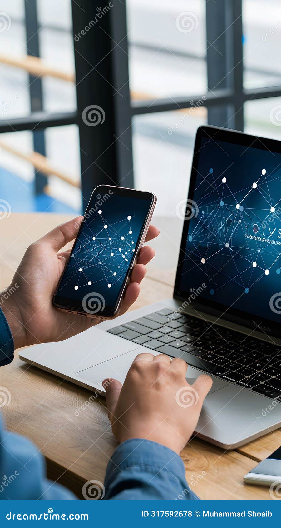 A Tech-savvy Professional in Modern Office with Smartphone and Laptop ...