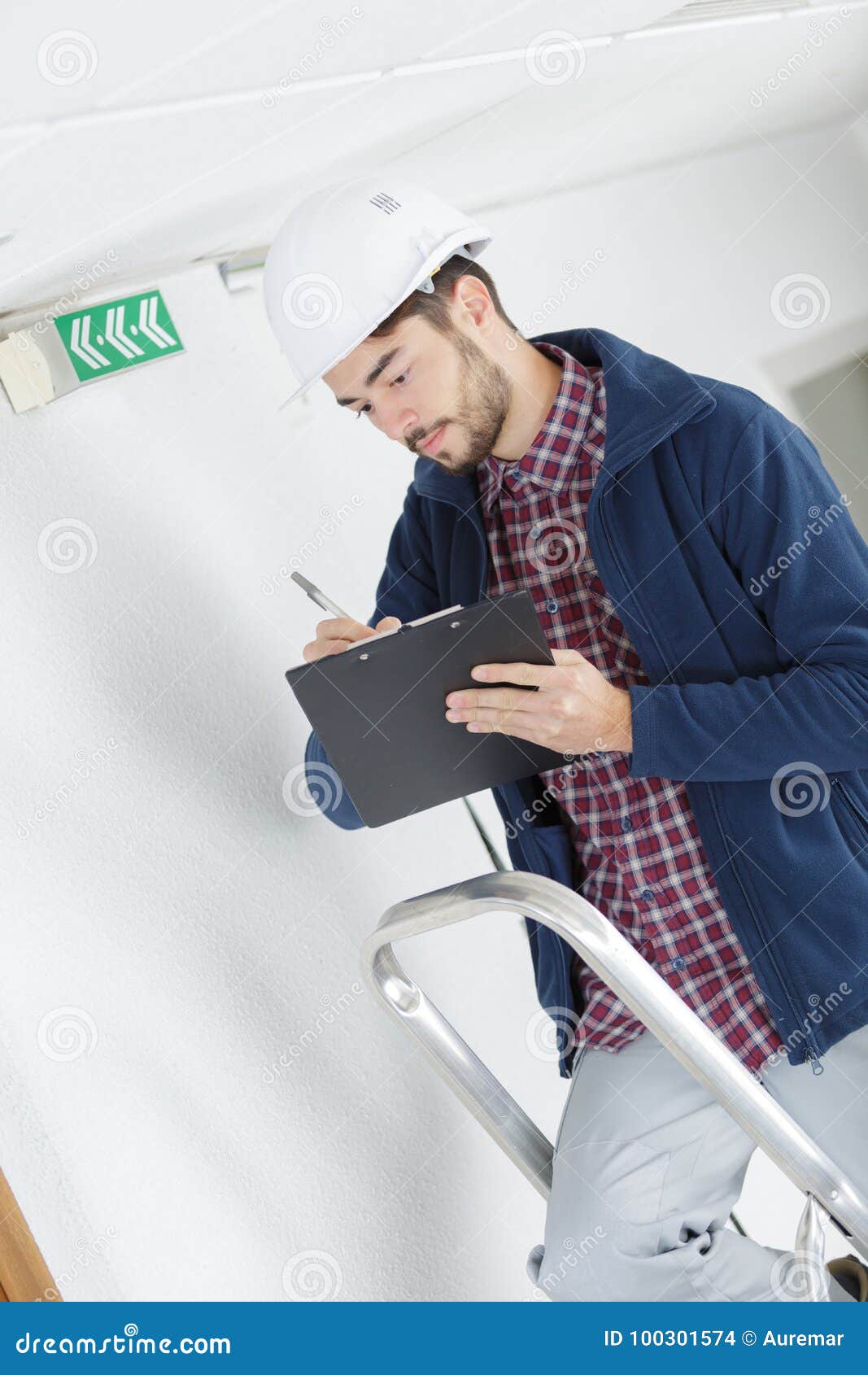 Techinician after Fitting Emergency Exit Sign Stock Photo - Image of ...