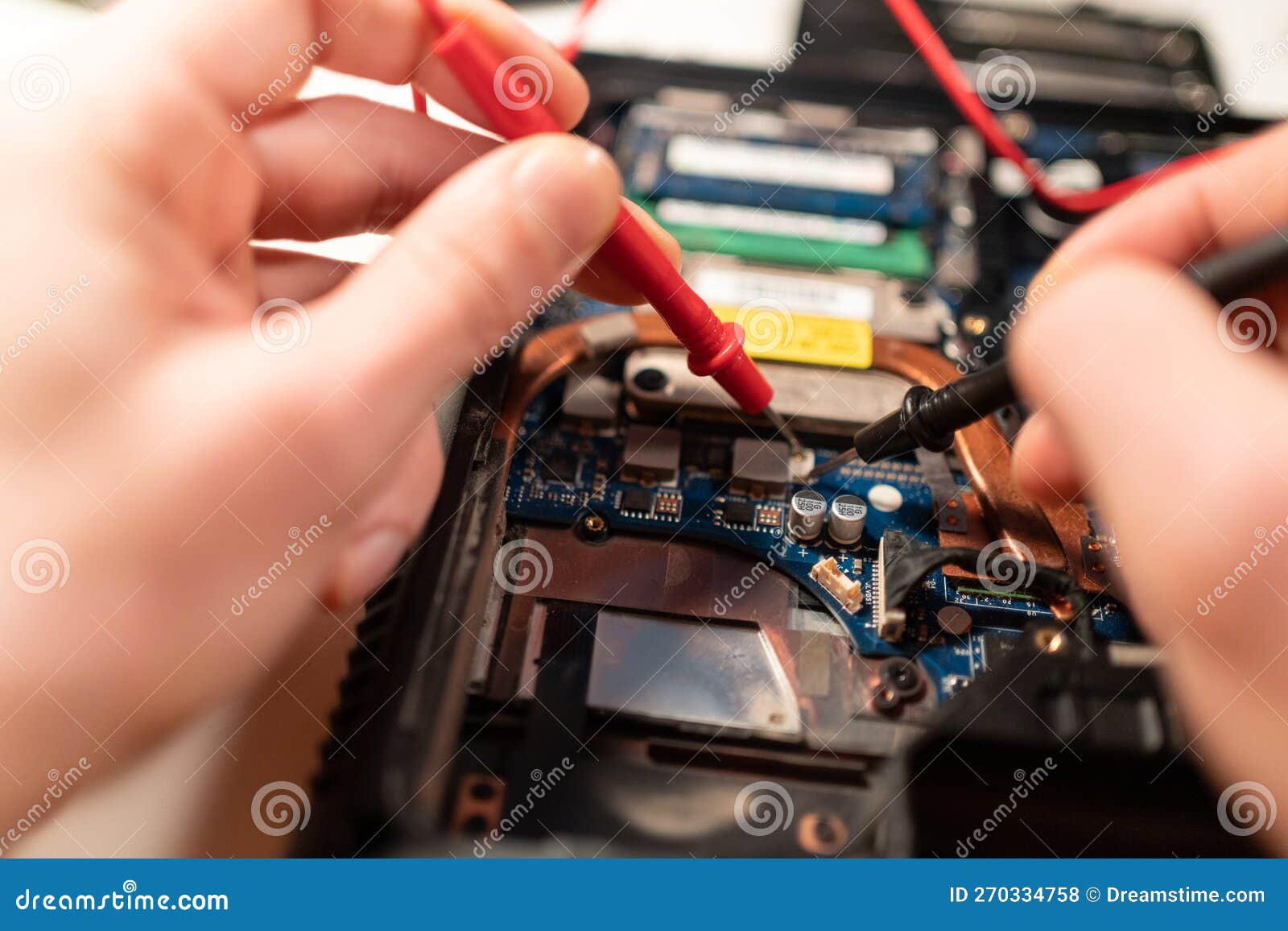 Technical Check Problem for Laptop Computer with Multimeter, Close Up ...