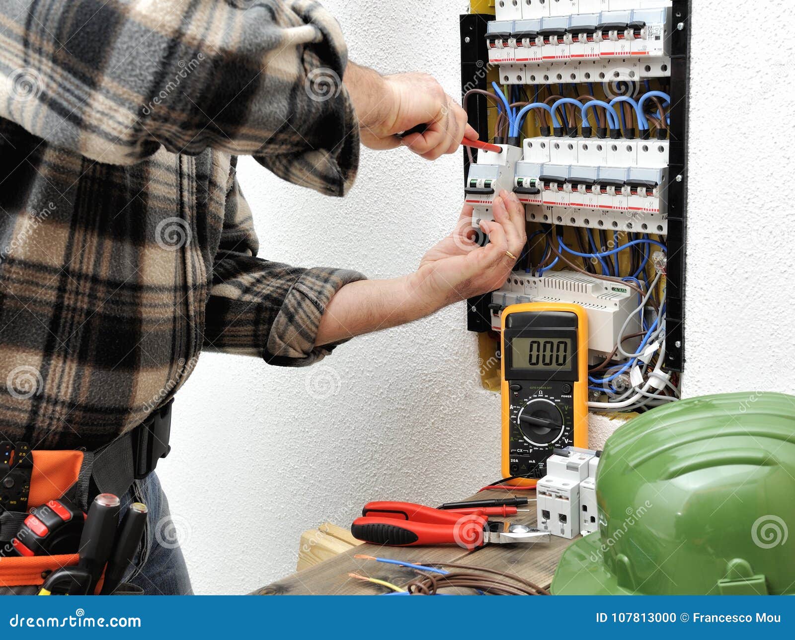 Electrician Technician at Work on a Residential Electric Panel Stock ...