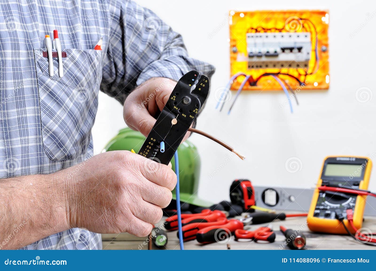 Electrician Technician at Work on a Residential Electric System Stock ...