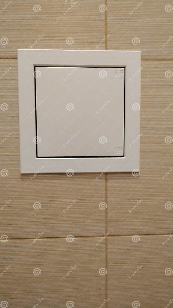 Technical Hatch on the Wall Lined with Bright Tiles. Close-up Stock ...