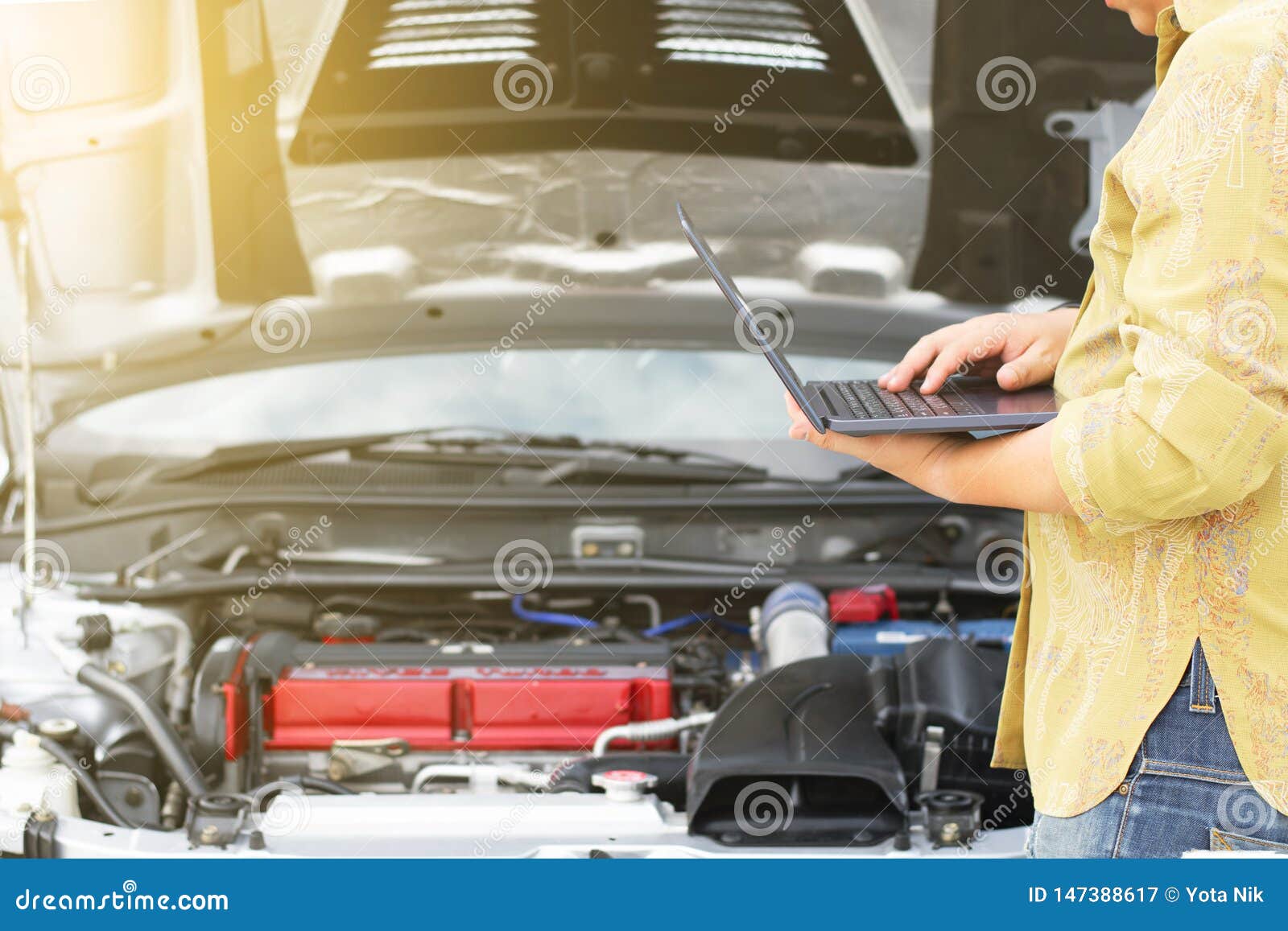 Technical Man is Using Laptop To Tuning Racing Car with Engine Bay ...