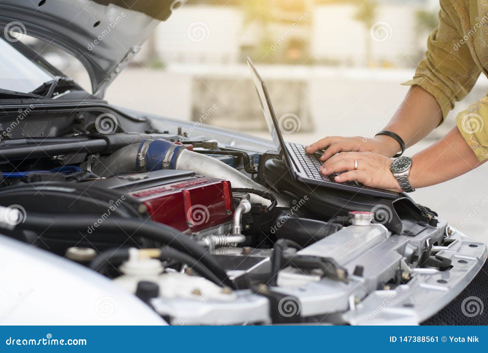 Technical Man is Using Laptop To Tuning Racing Car with Engine Bay ...