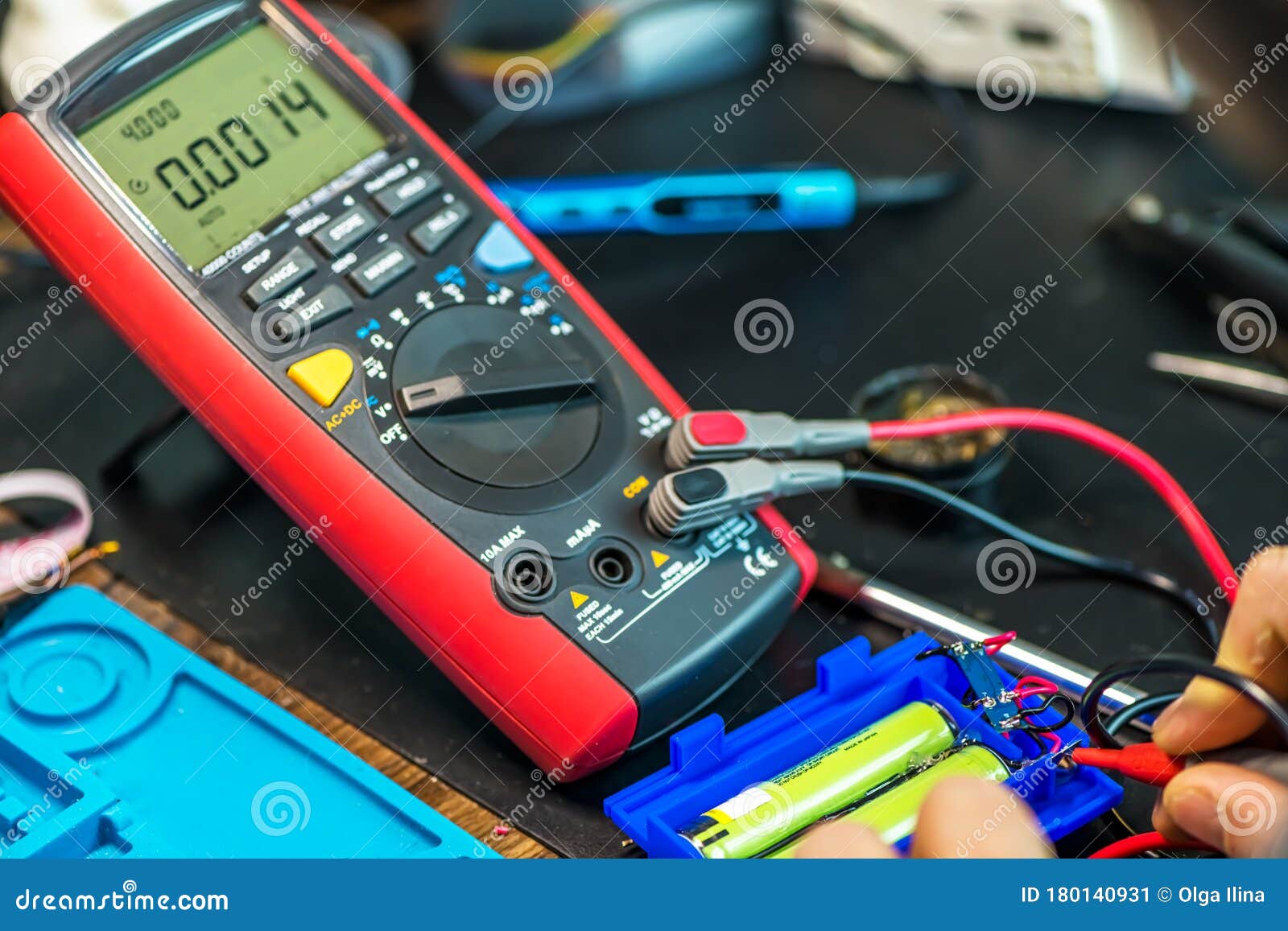 Technical Master Tests the Battery Voltage. Technical Support, Repair ...