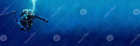 Technical Scuba Diver in a Horizontal Position with Sun Rays Blue ...