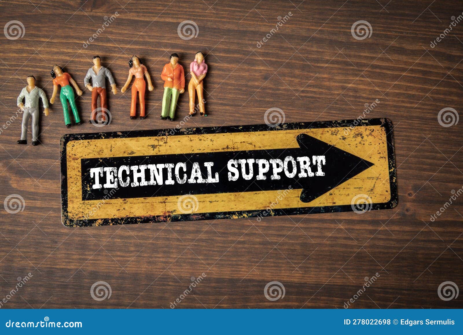 Technical Support. Direction Arrow and Miniature Human Figures on a ...