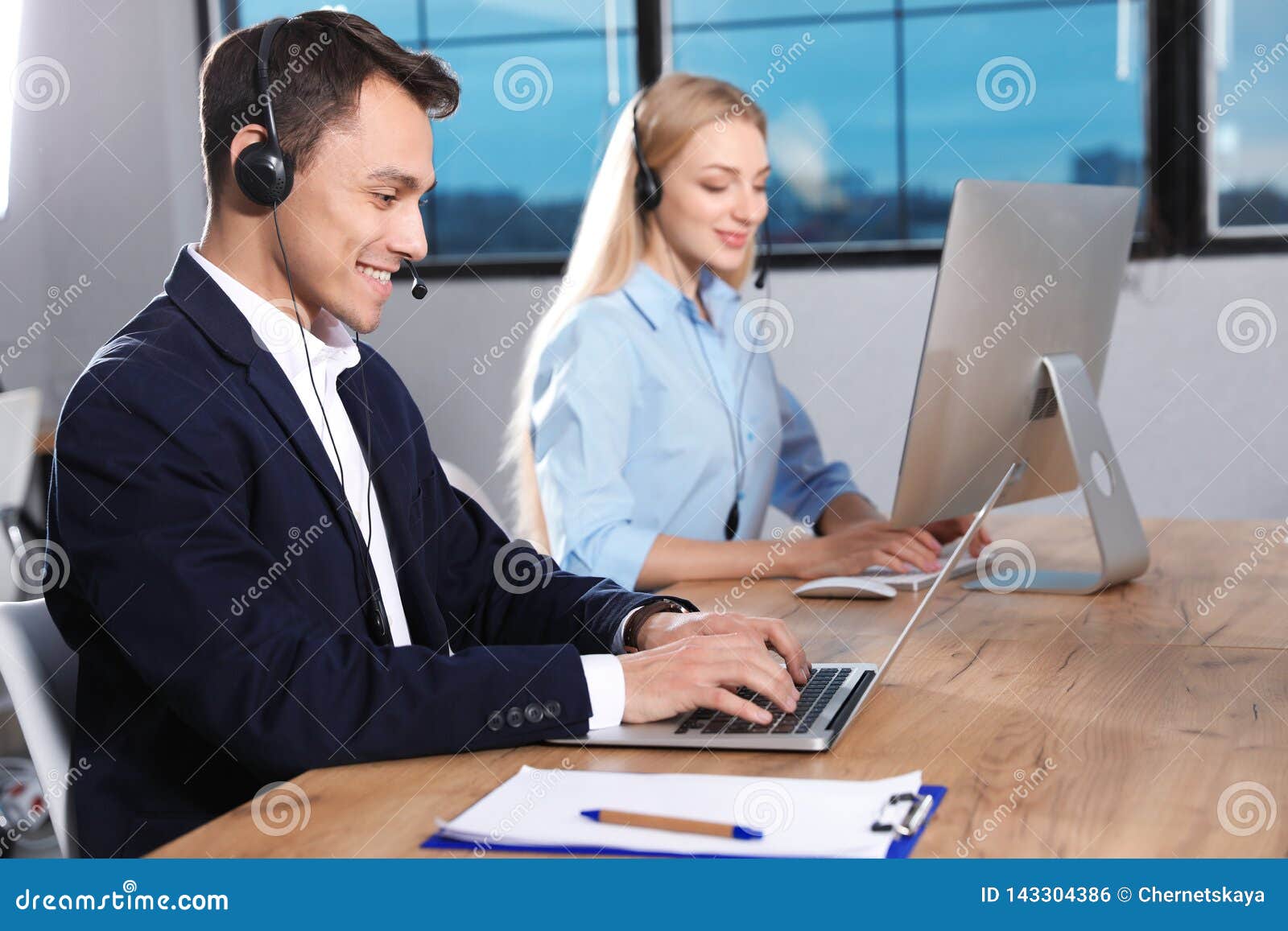 Technical Support Operator with Colleague in Office Stock Photo - Image ...