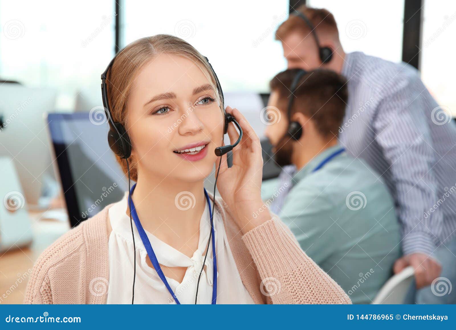 Technical Support Operator with Colleagues in Stock Image - Image of ...