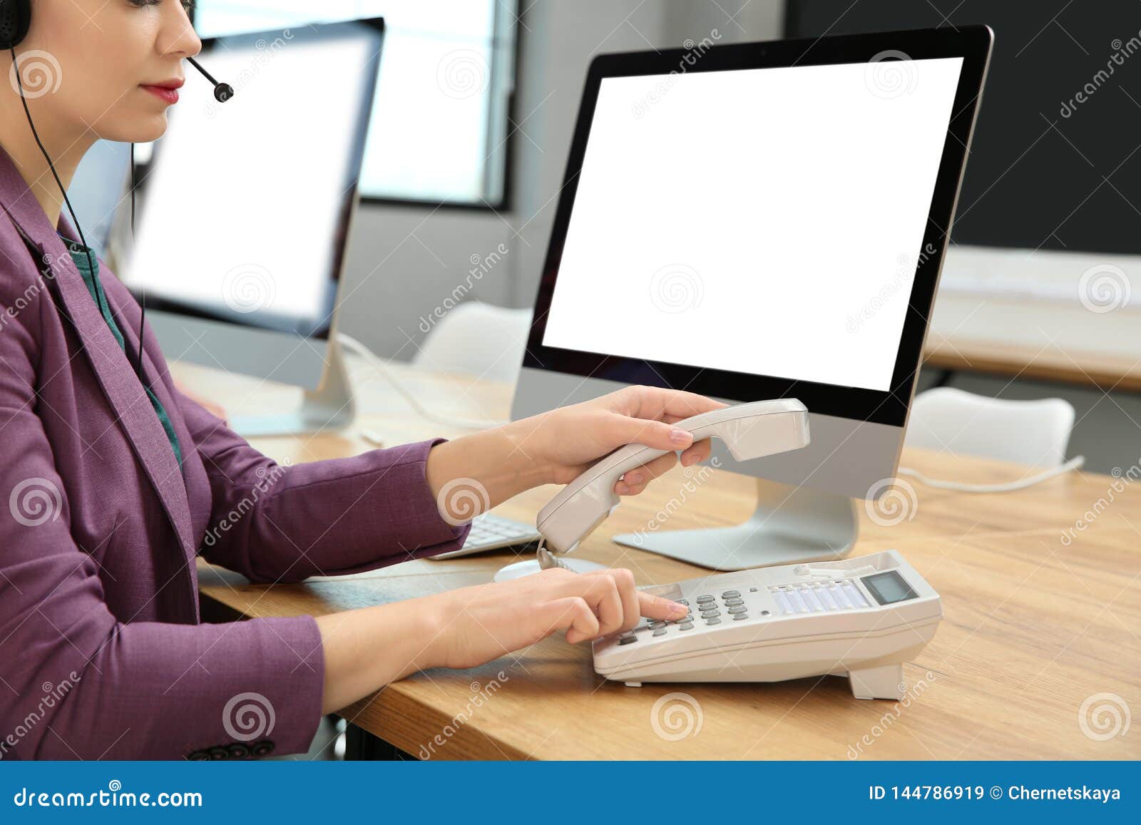 Technical Support Operator Dialing Number on Telephone at Table, Stock ...