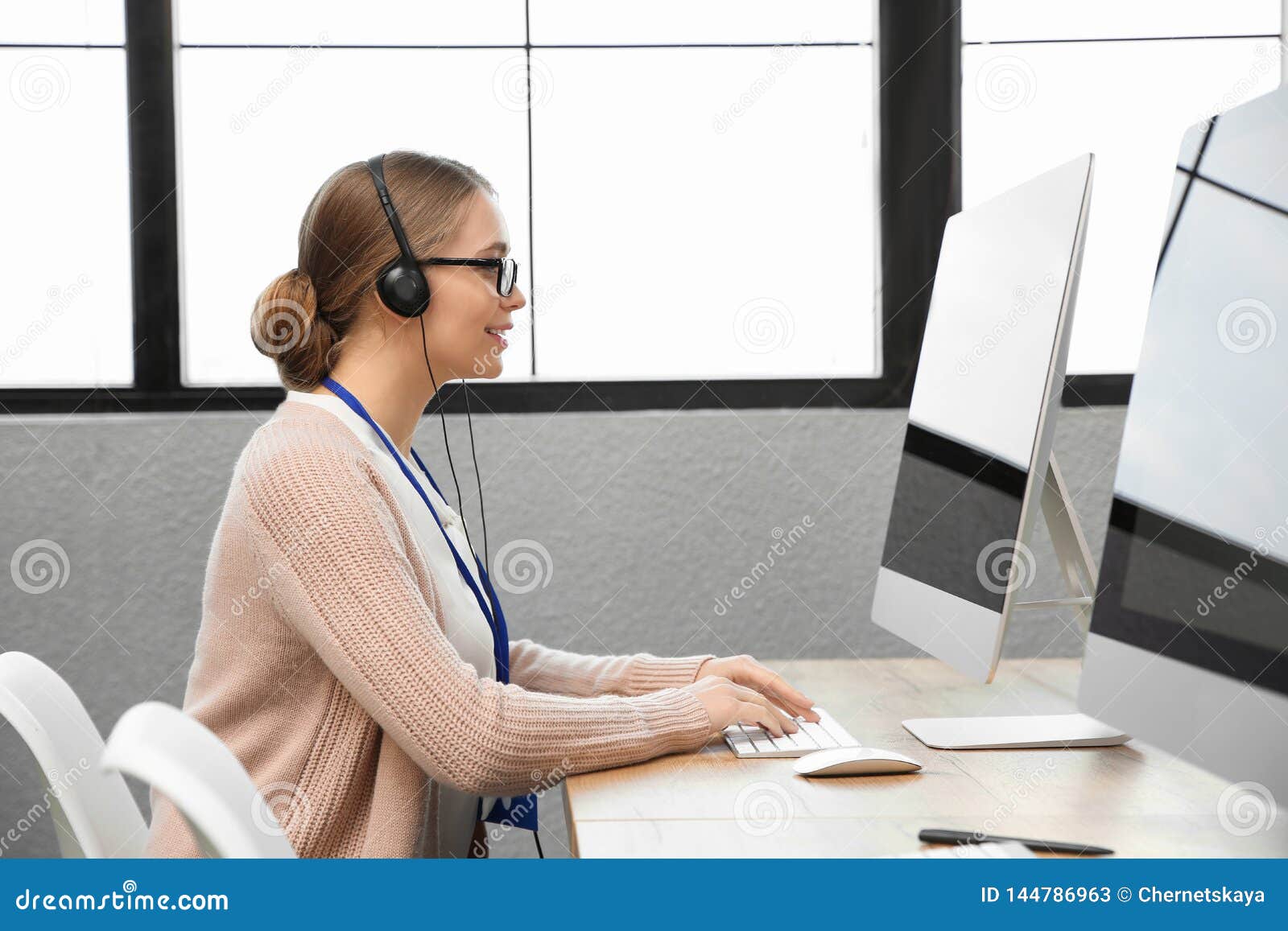 Technical Support Operator Working with Computer at Table Stock Image ...