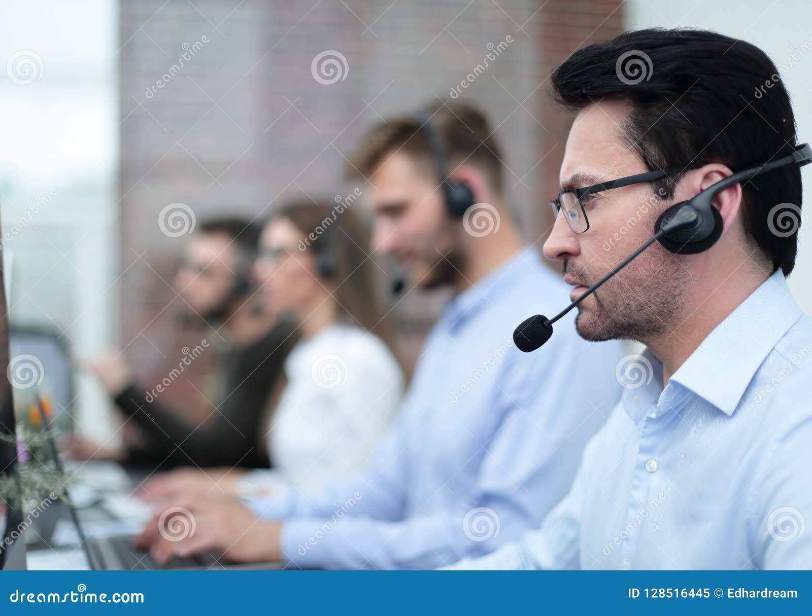 Technical Support Specialist on the Background of Colleagues Stock ...