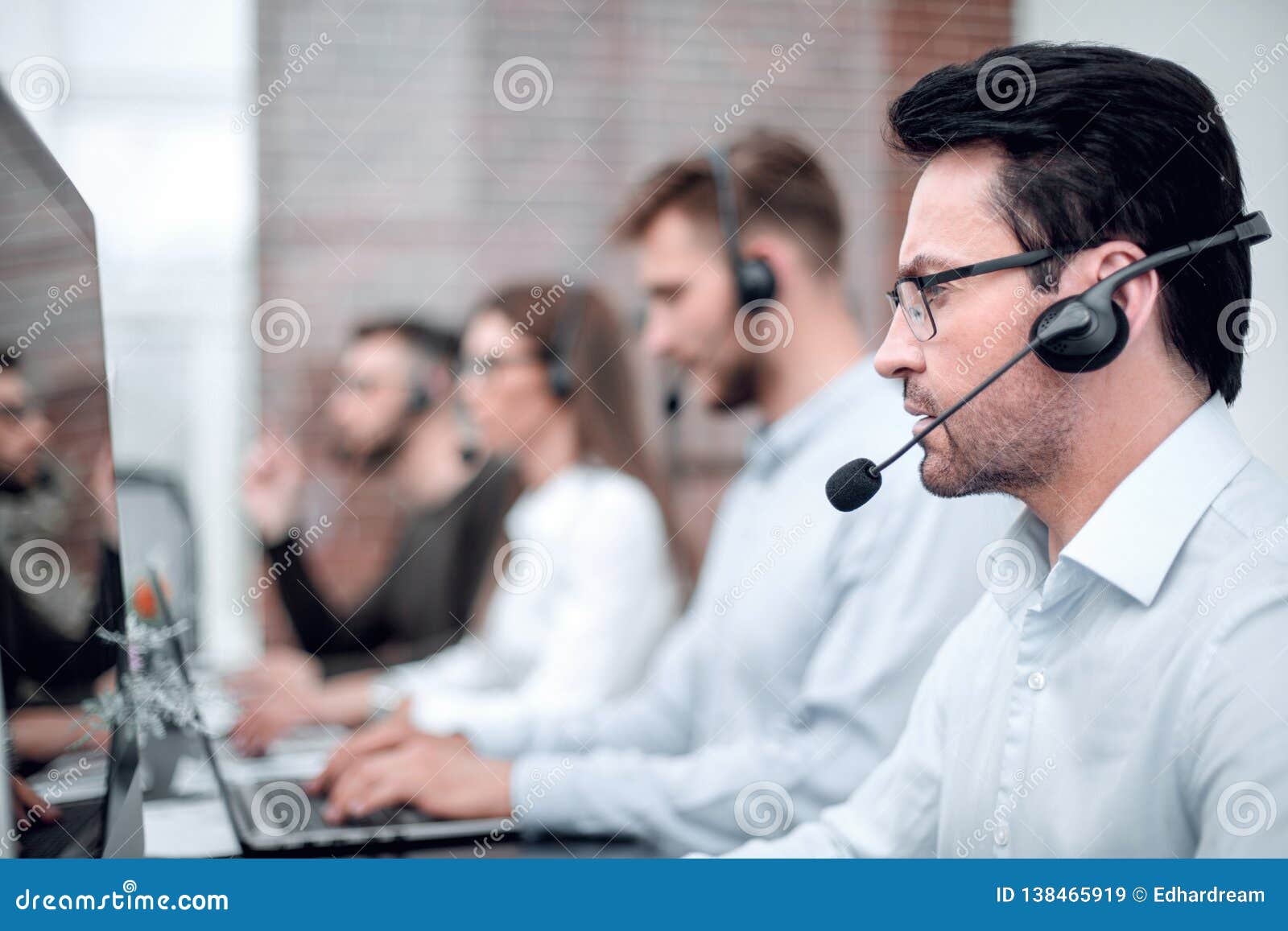 Technical Support Specialist on the Background of Colleagues Stock ...