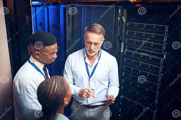 The Technical Team are on the Case. a Group of Technicians Using a ...