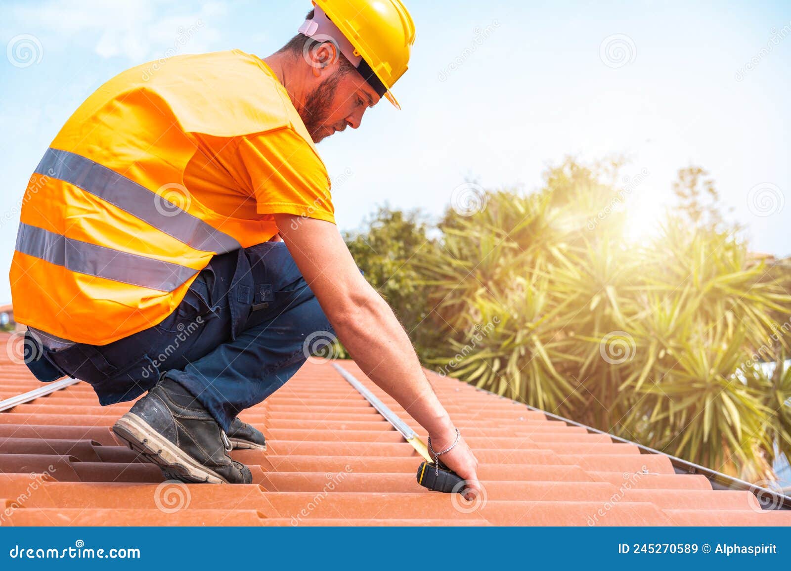 Technical Worker Takes Measurements on the Roof of a House Stock Image ...