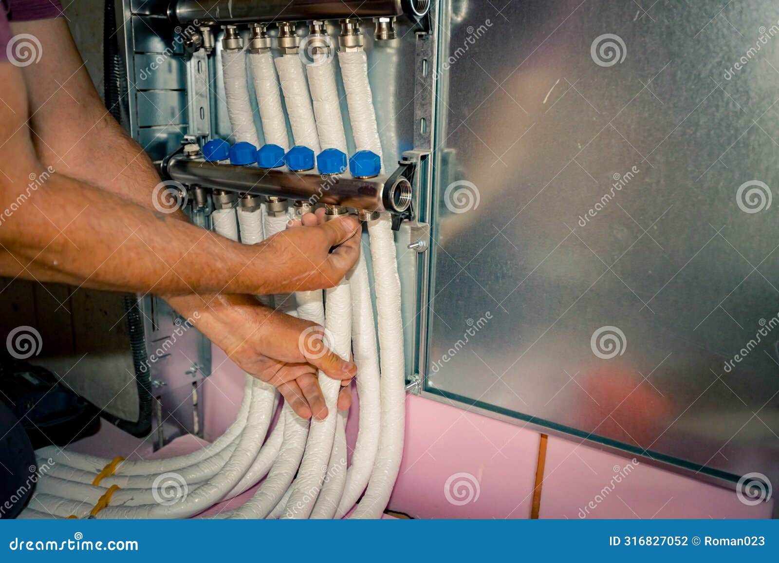 Technician is Adjust Distribution and Control Panel of Heat Pump ...