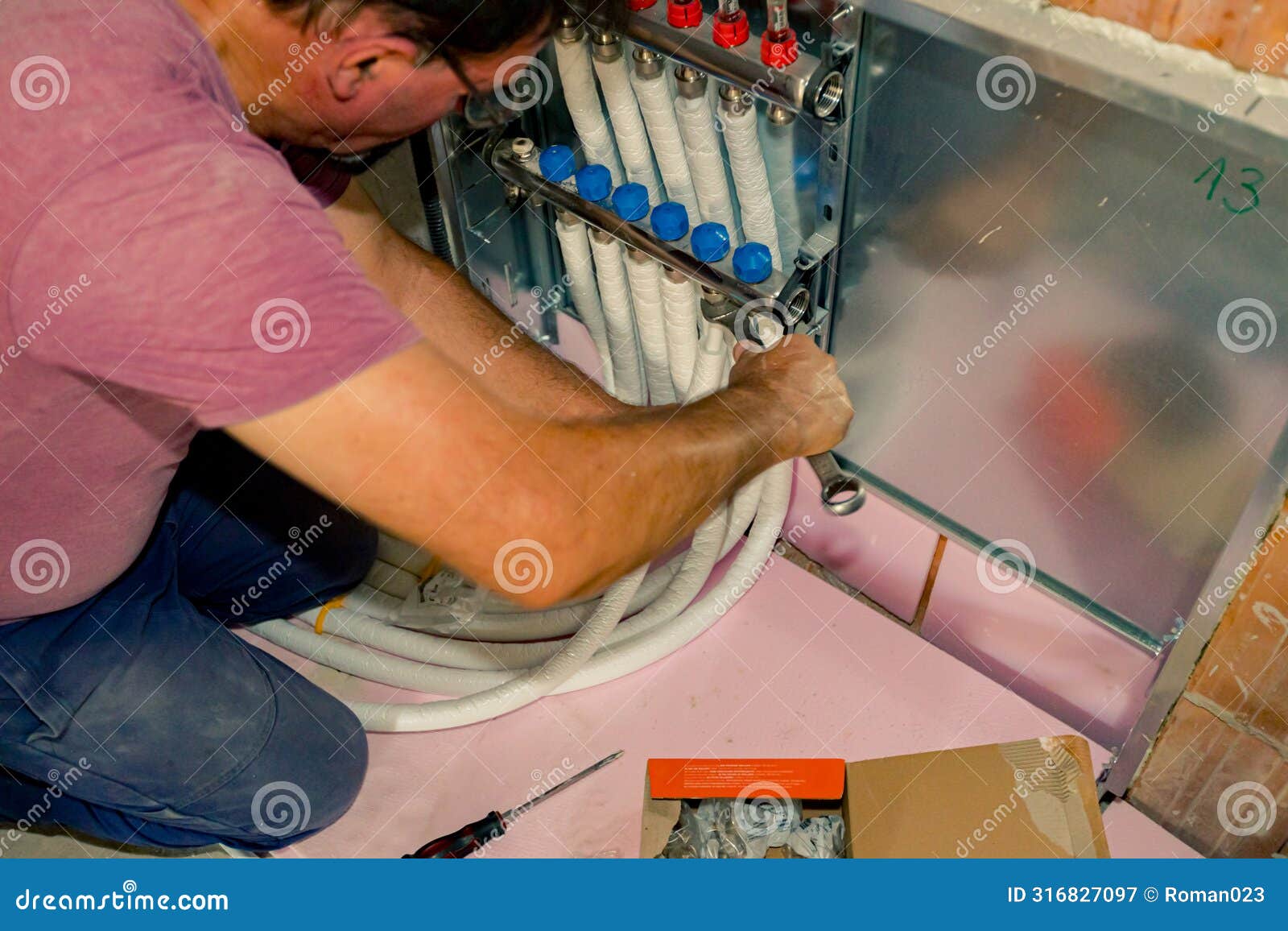 Technician is Adjust Distribution and Control Panel of Heat Pump ...