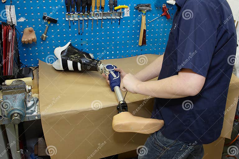 A Technician Adjusts a Prosthetic Foot. Stock Image - Image of object ...