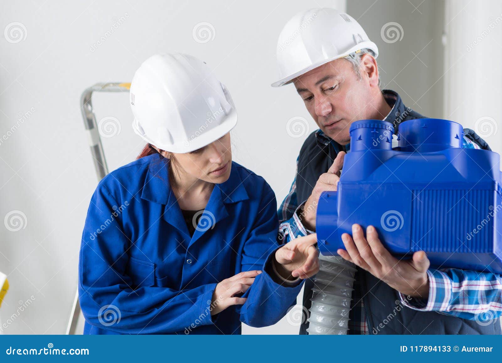 Technician and Apprentice Working on Ventilation Pipes Stock Image ...