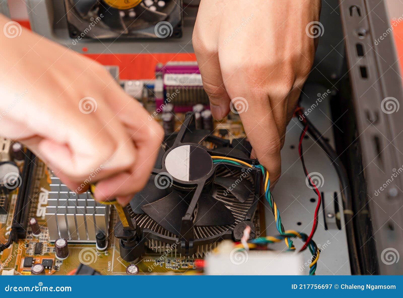 The Technician Assembles the CPU Cooling Fan after Replacing the CPU ...