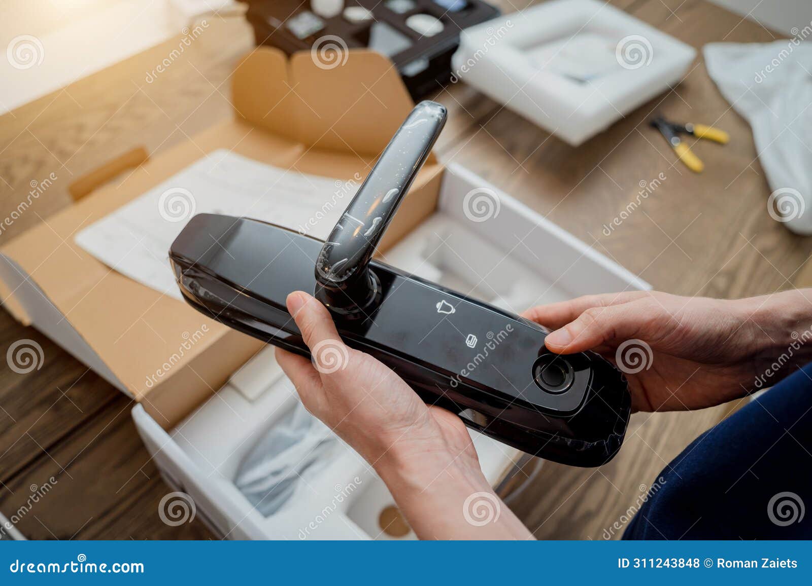 A Technician Assembles and Installs Smart Electronic Door Lock for ...