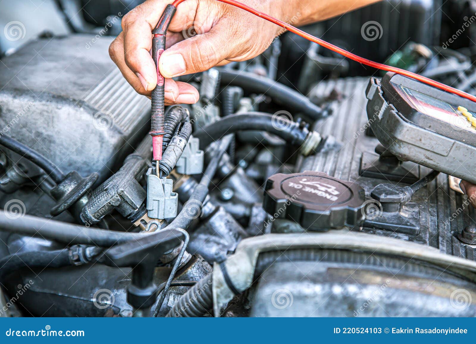 Technician Auto Mechanic Using a Power Meter To Check the Car ...