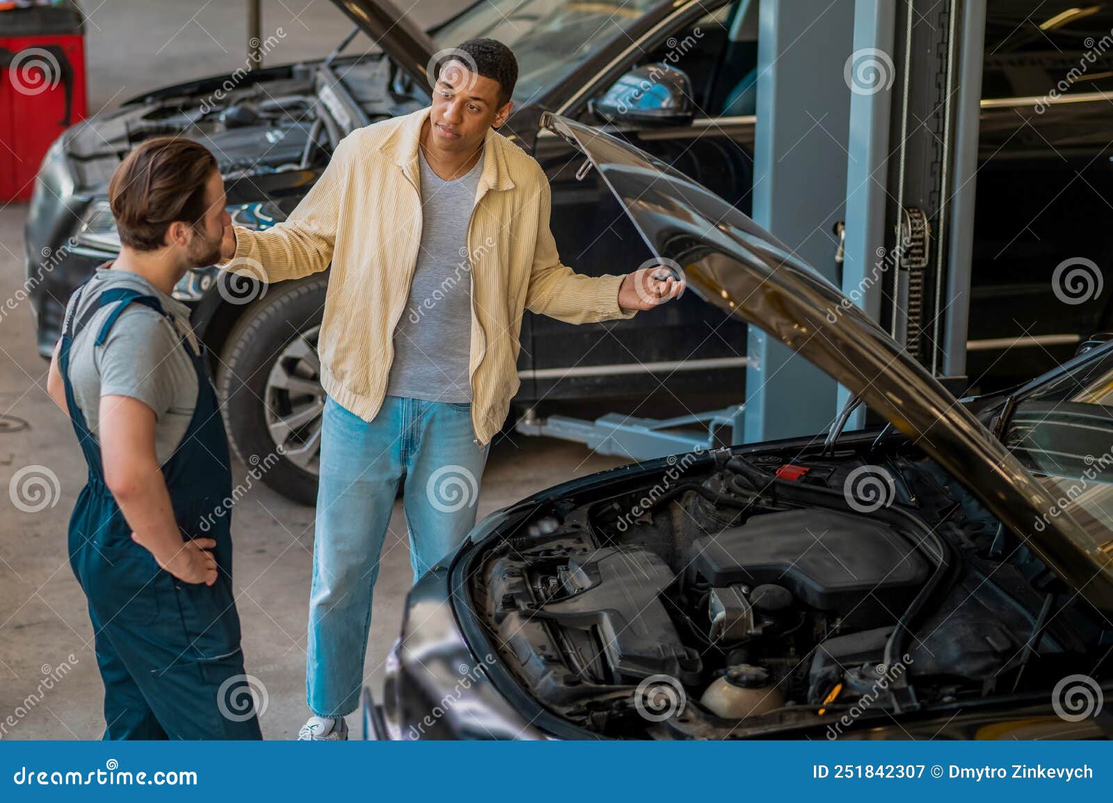 Technician in Car Service Talking To the Client Stock Image - Image of ...