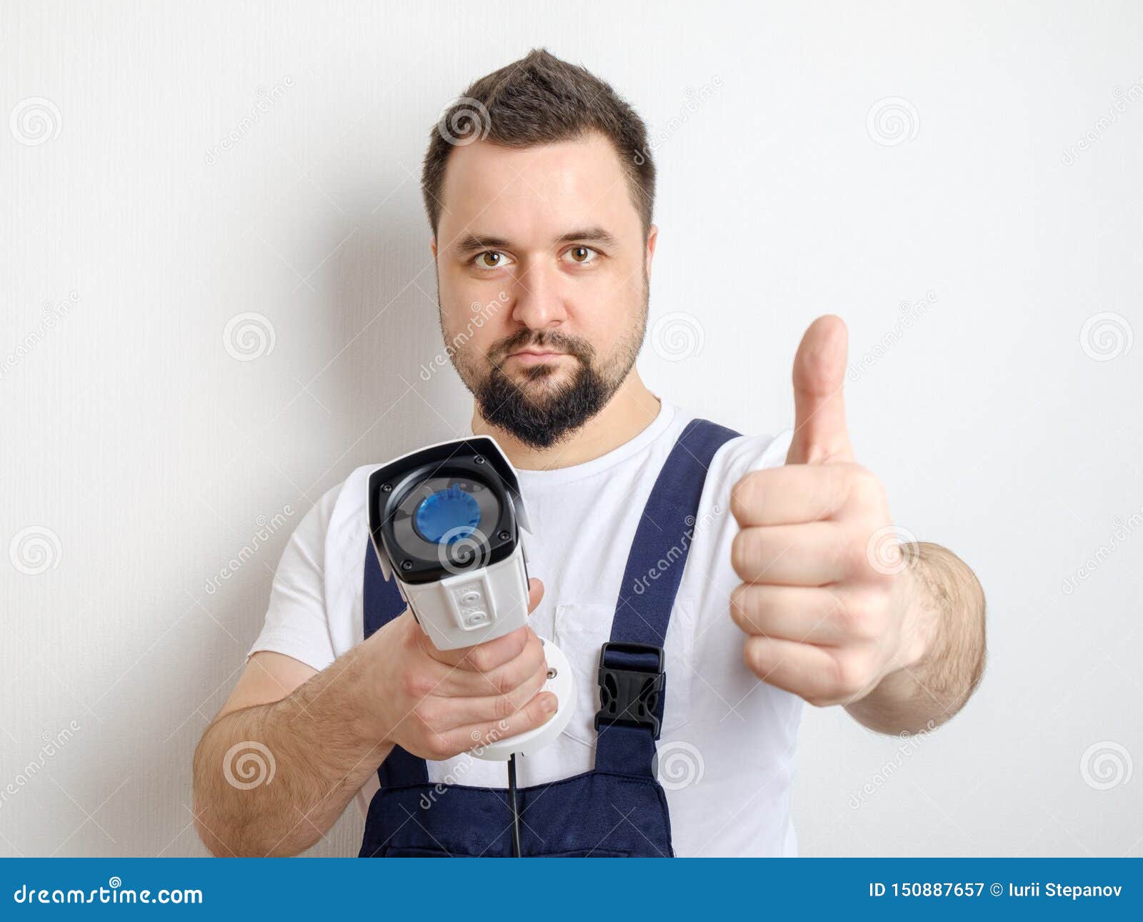 Technician with CCTV Security Camera Showing Thumbs Up Gesture Stock ...