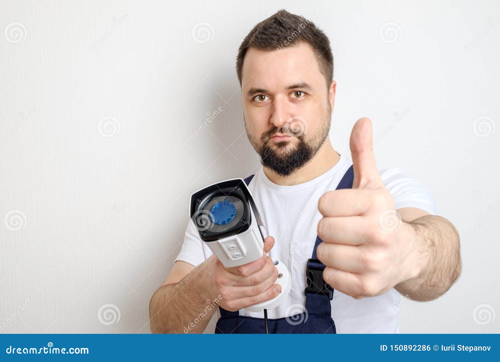 Technician with CCTV Security Camera Showing Thumbs Up Gesture Stock ...
