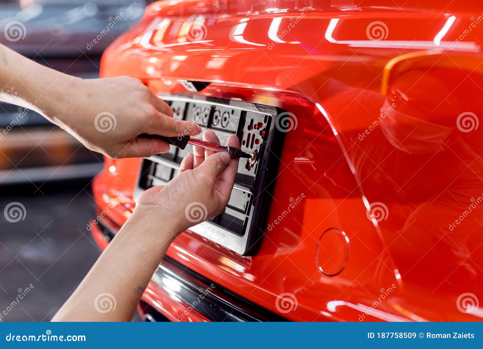 Technician Changing Car Plate Number in Service Center. Stock Image ...