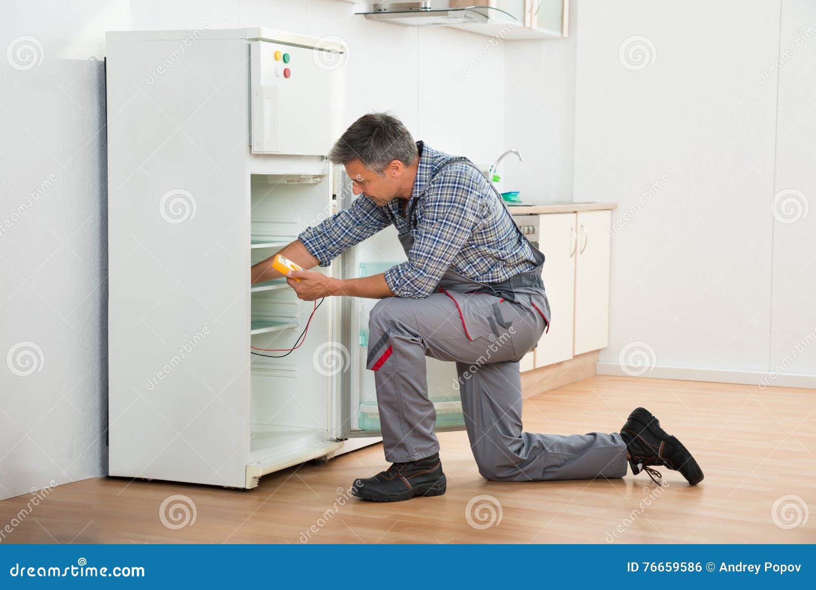 Technician Checking Fridge with Digital Multimeter Stock Photo - Image ...