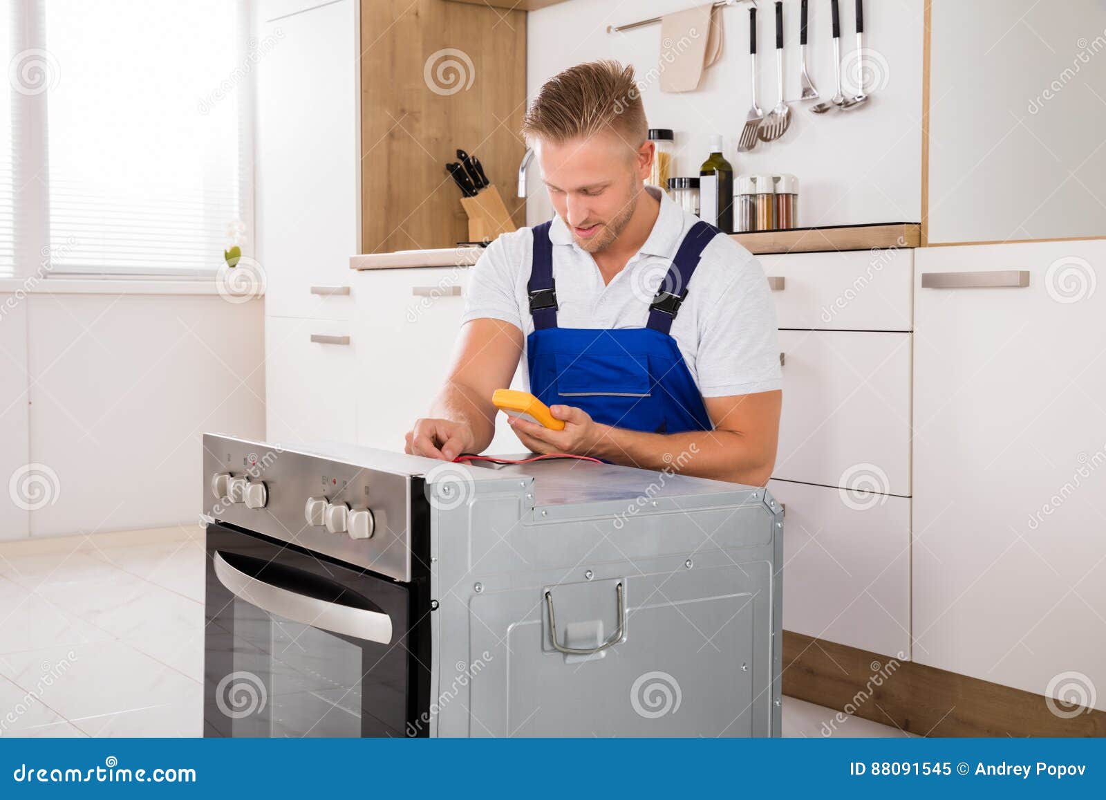 Technician Checking Oven with Digital Multimeter Stock Image - Image of ...