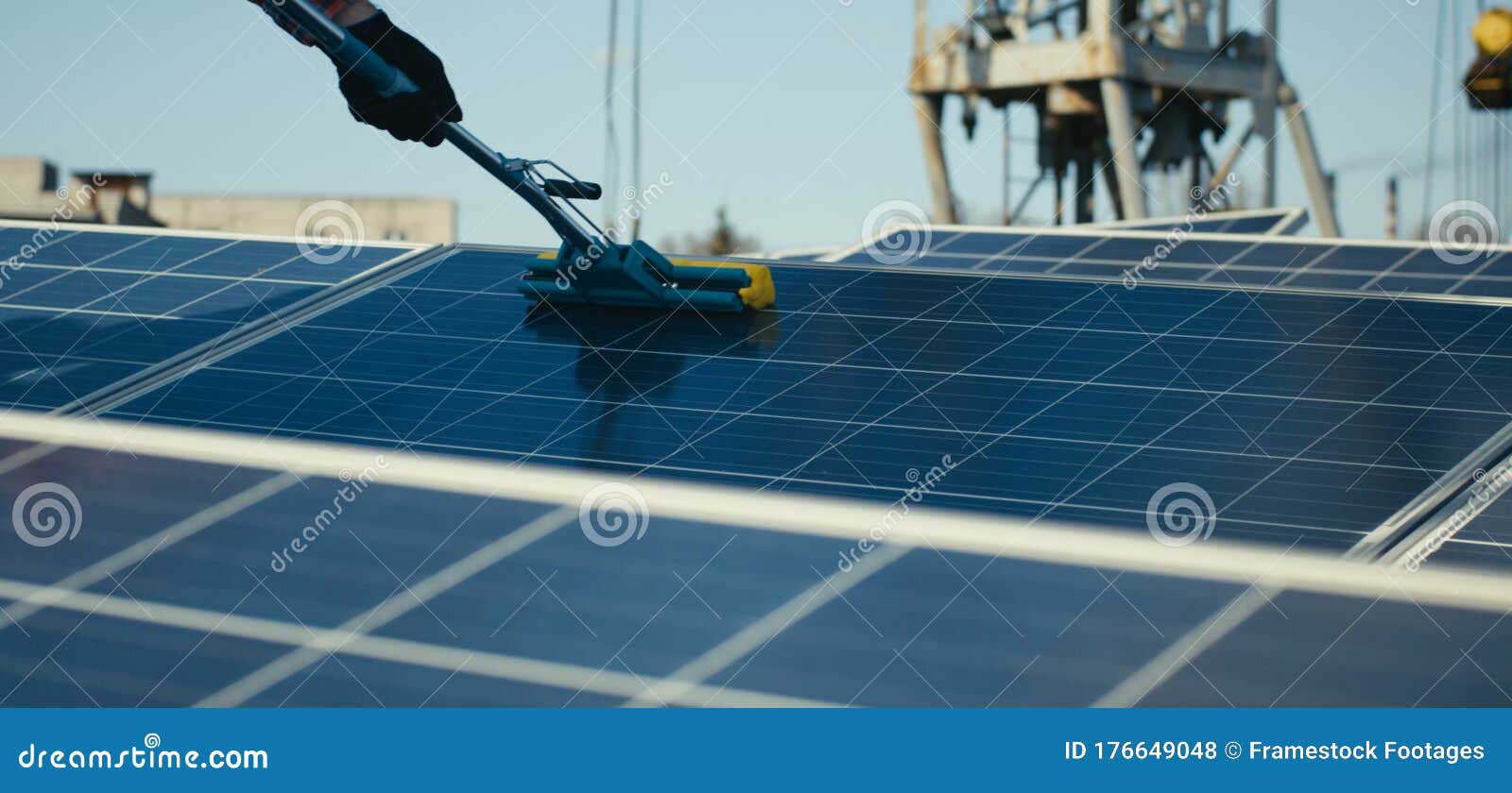 Technician Cleaning Solar Panels on Flat Roof Stock Photo - Image of ...