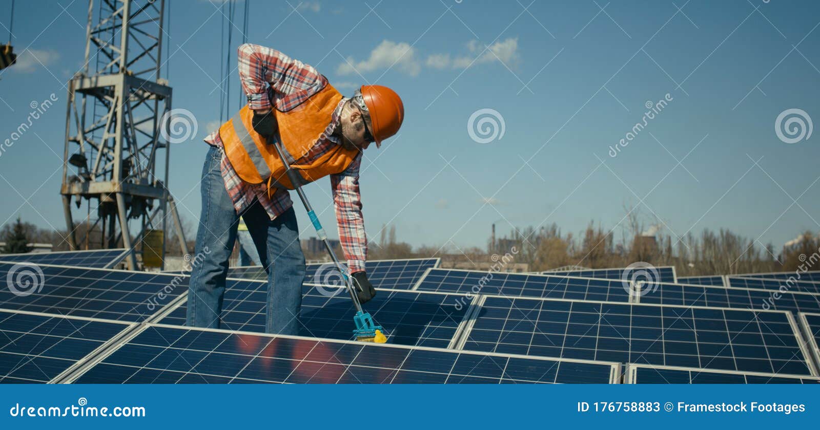 Technician Cleaning Solar Panels on Flat Roof Stock Image - Image of ...