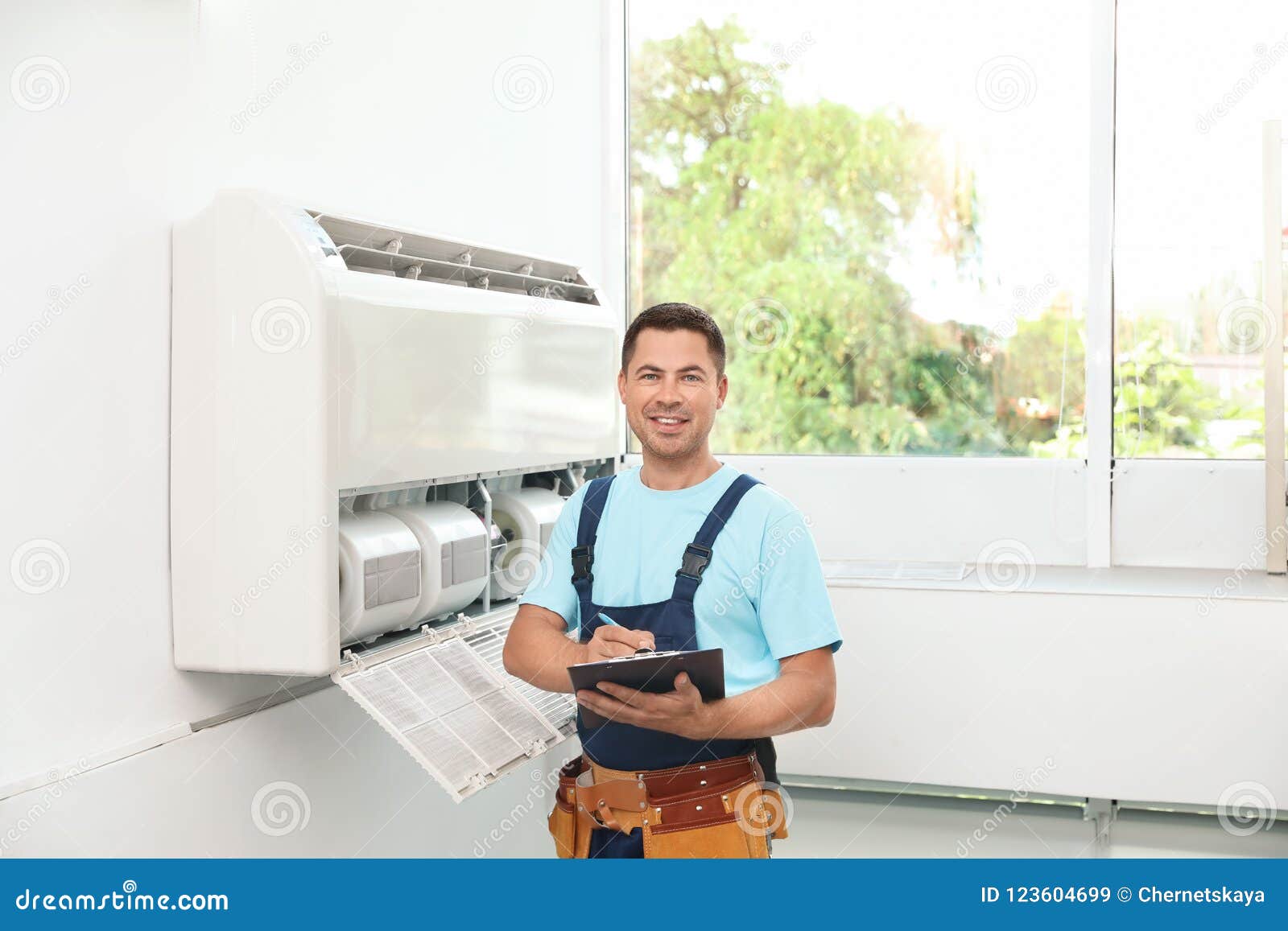 Technician with Clipboard Near Air Conditioner Stock Image - Image of ...