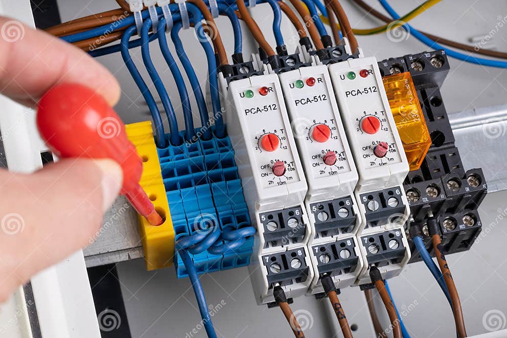 Technician Connecting Wires in Electrical Control Panel Stock Image ...