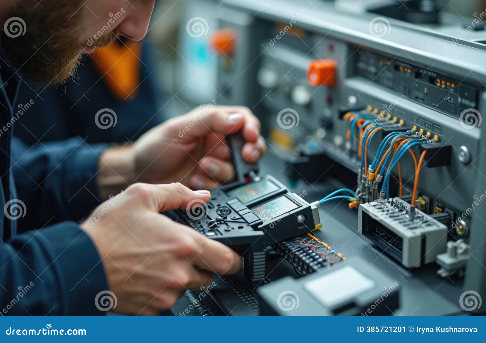 An Engineer Installs A New Battery Pack Into An Uninterruptible Power Supply. Replacing The ...