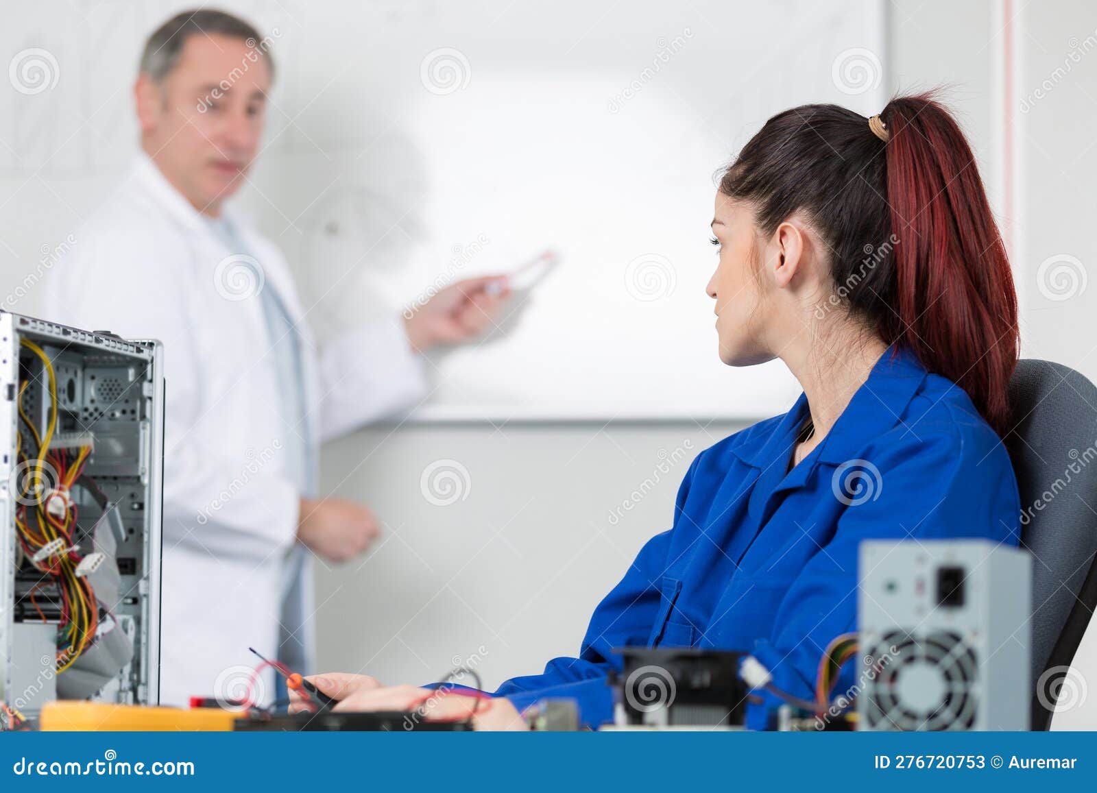 Technician by Dismantled Computer Listening To Teacher at Whiteboard ...