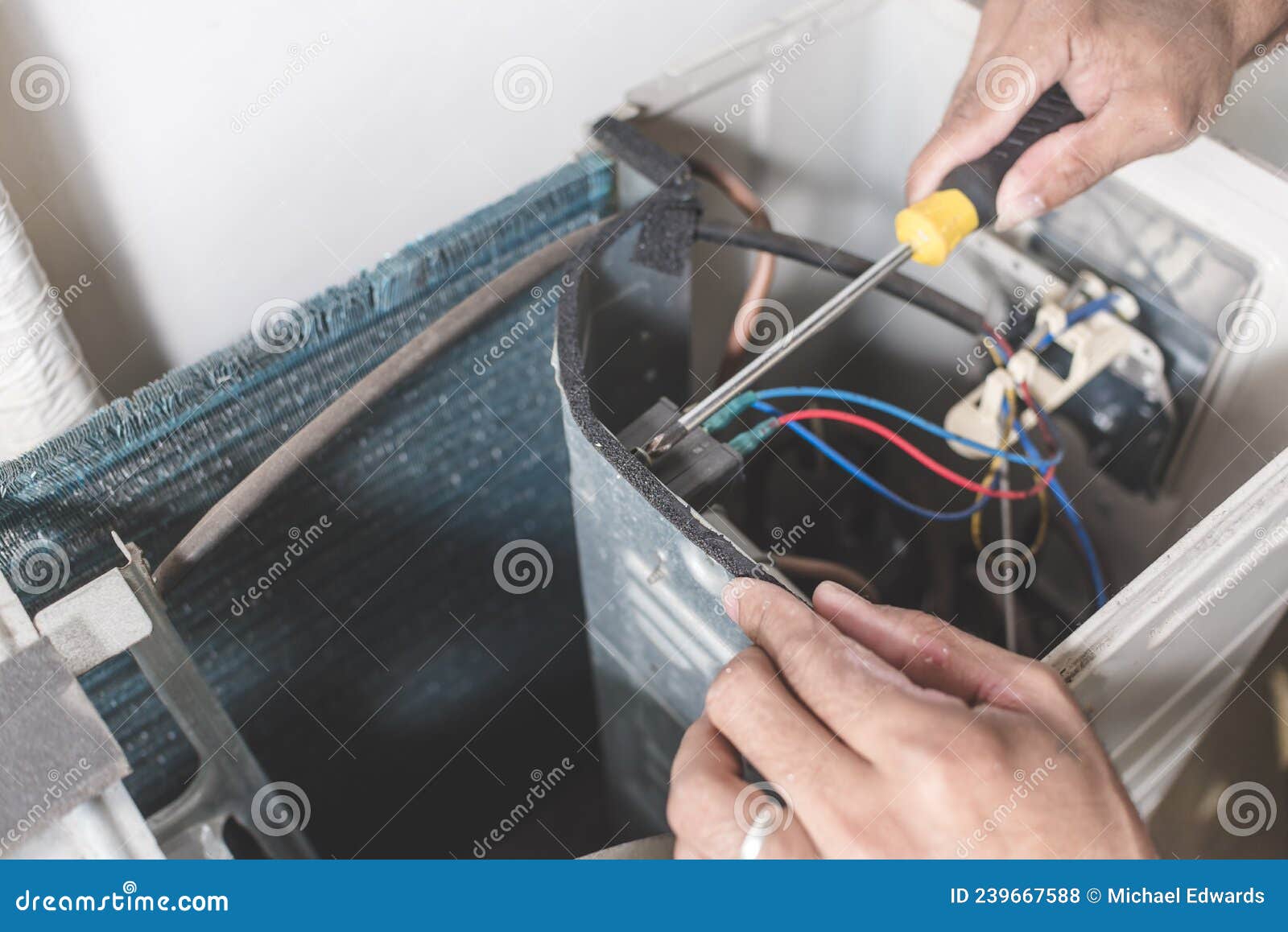 A Technician Dismantles the Inside of a Outdoor Compressor Unit of a ...